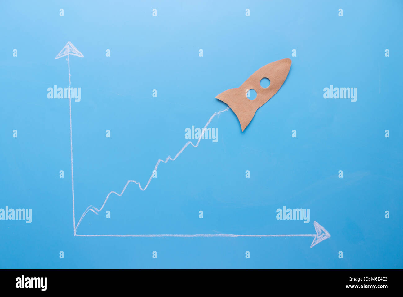 graph sketch and a paper rocket on it. Concept of new project Stock ...