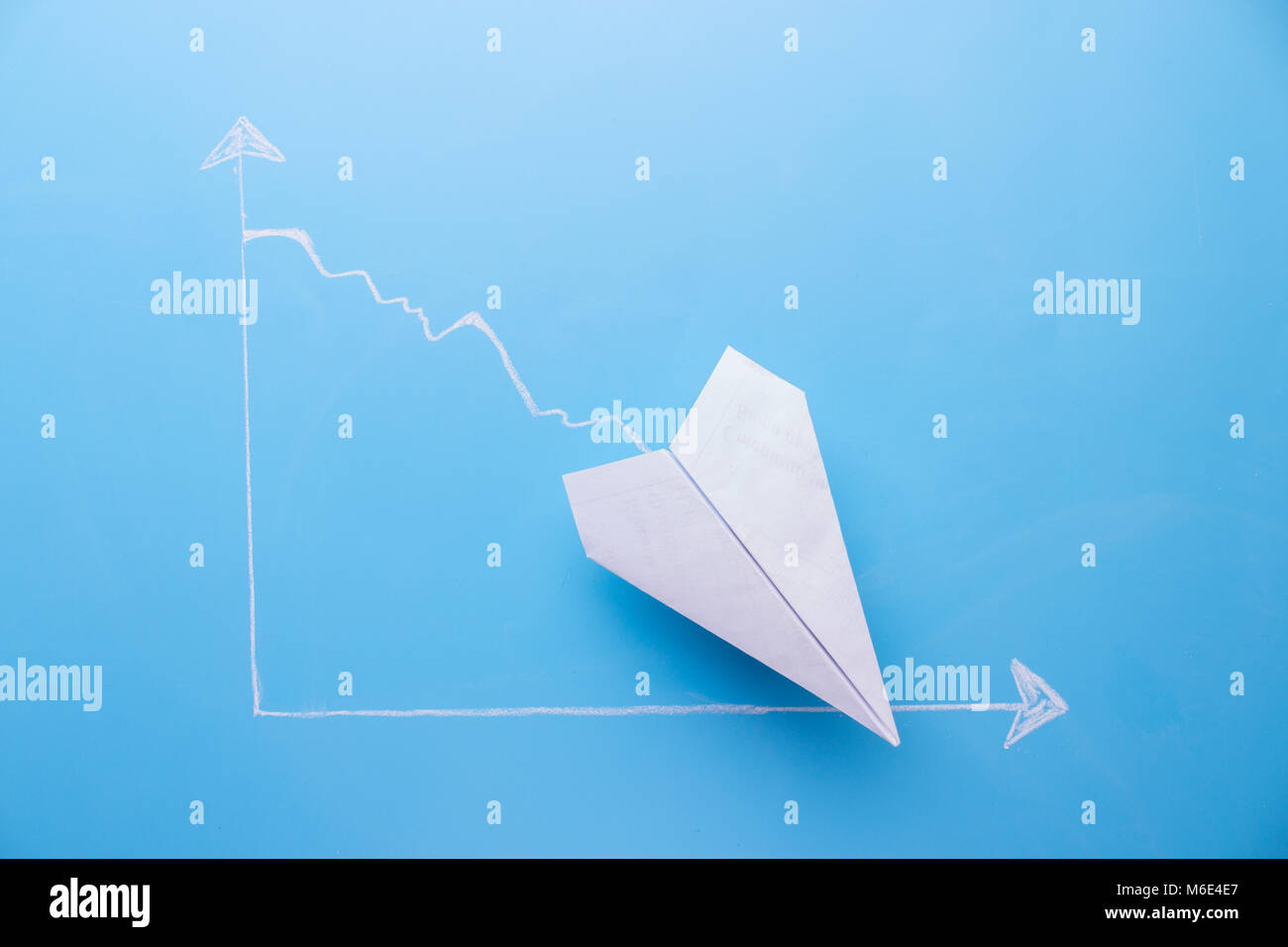 graph going down with rocket or plane fall Stock Photo - Alamy