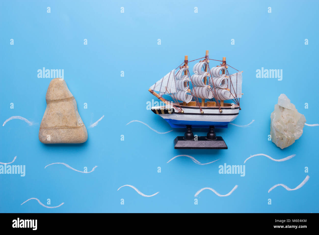 danger for ship concept. iceberg or a rock on its way Stock Photo - Alamy