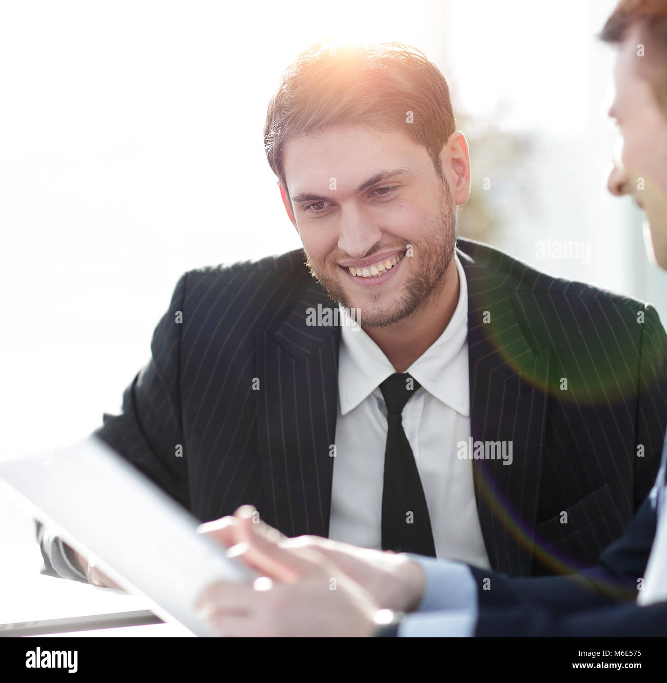 close-up.businessman talking to colleague Stock Photo - Alamy