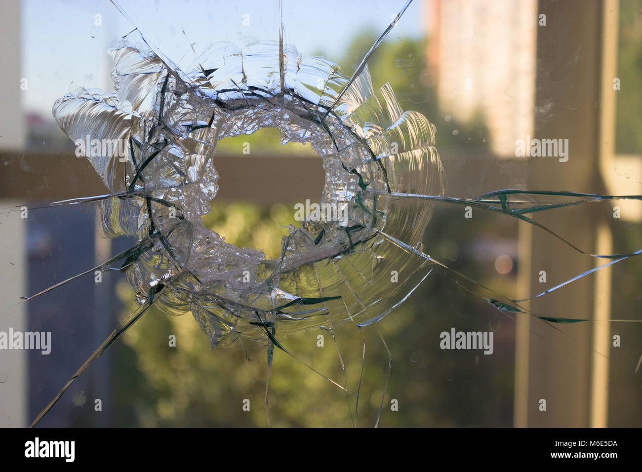 broken glass window reflecting blue sky. close up Stock Photo - Alamy