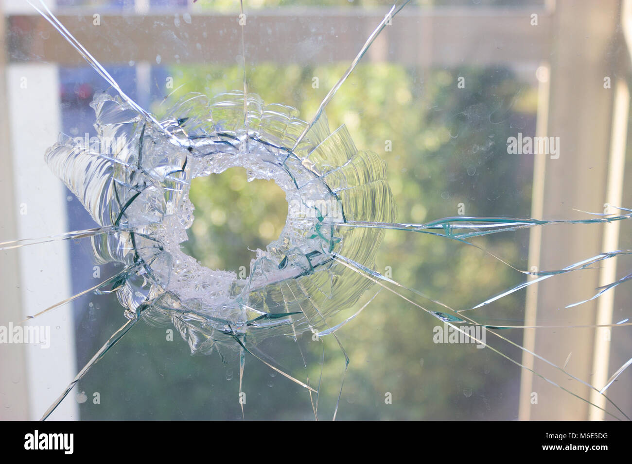 broken glass window reflecting blue sky. close up Stock Photo - Alamy
