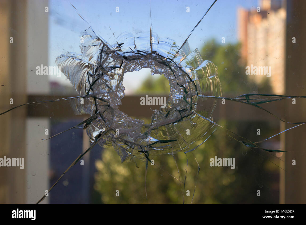 broken glass window reflecting blue sky. close up Stock Photo - Alamy
