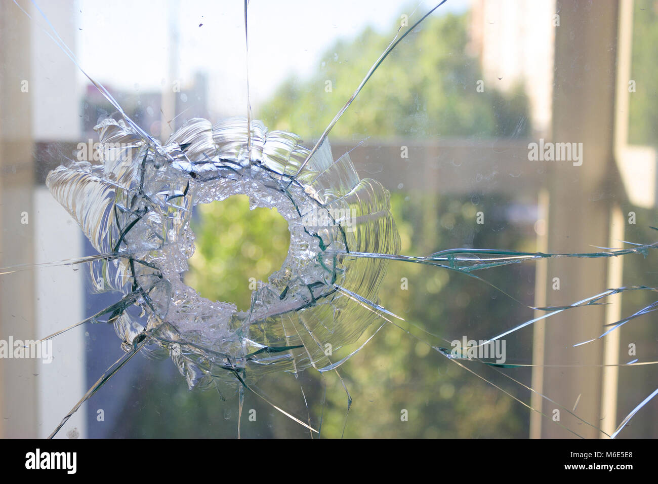 broken glass window reflecting blue sky. close up Stock Photo - Alamy