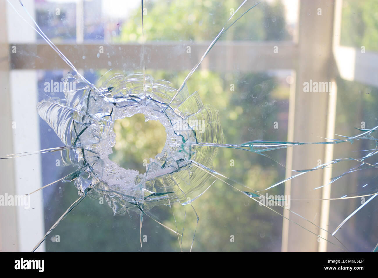 broken glass window reflecting blue sky. close up Stock Photo - Alamy