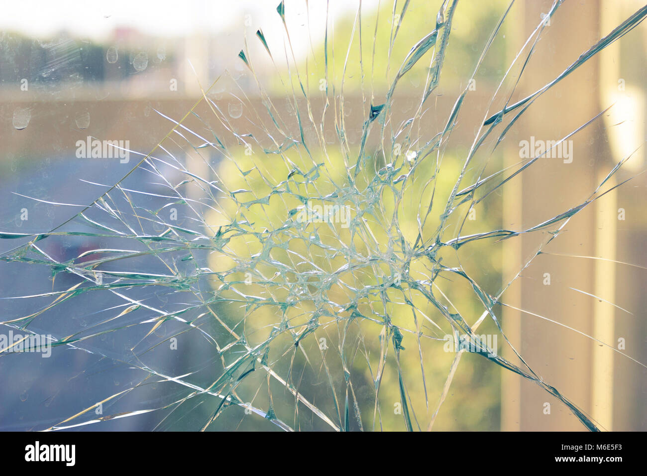 broken glass window reflecting blue sky. close up Stock Photo - Alamy