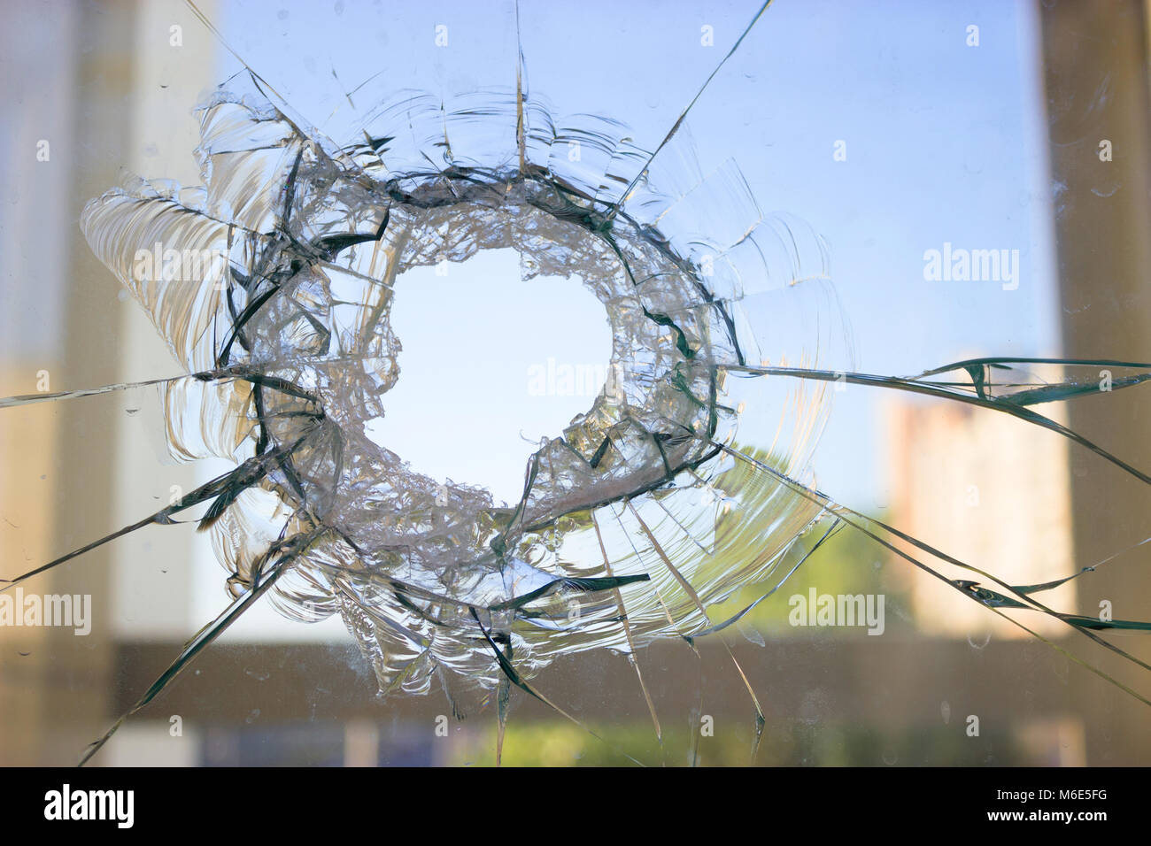 broken glass window reflecting blue sky. close up Stock Photo - Alamy