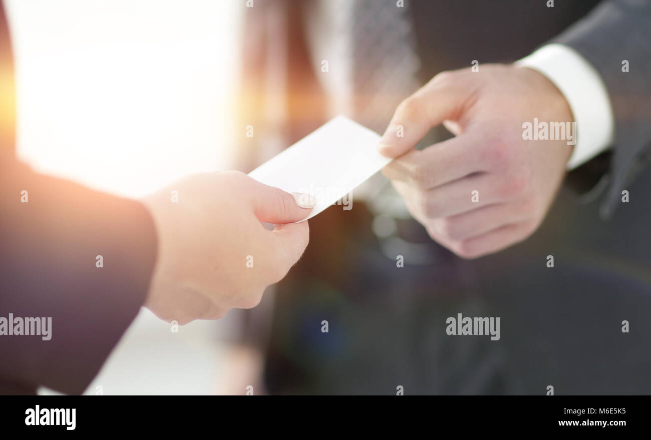 Exchange business card for first time meet Stock Photo - Alamy