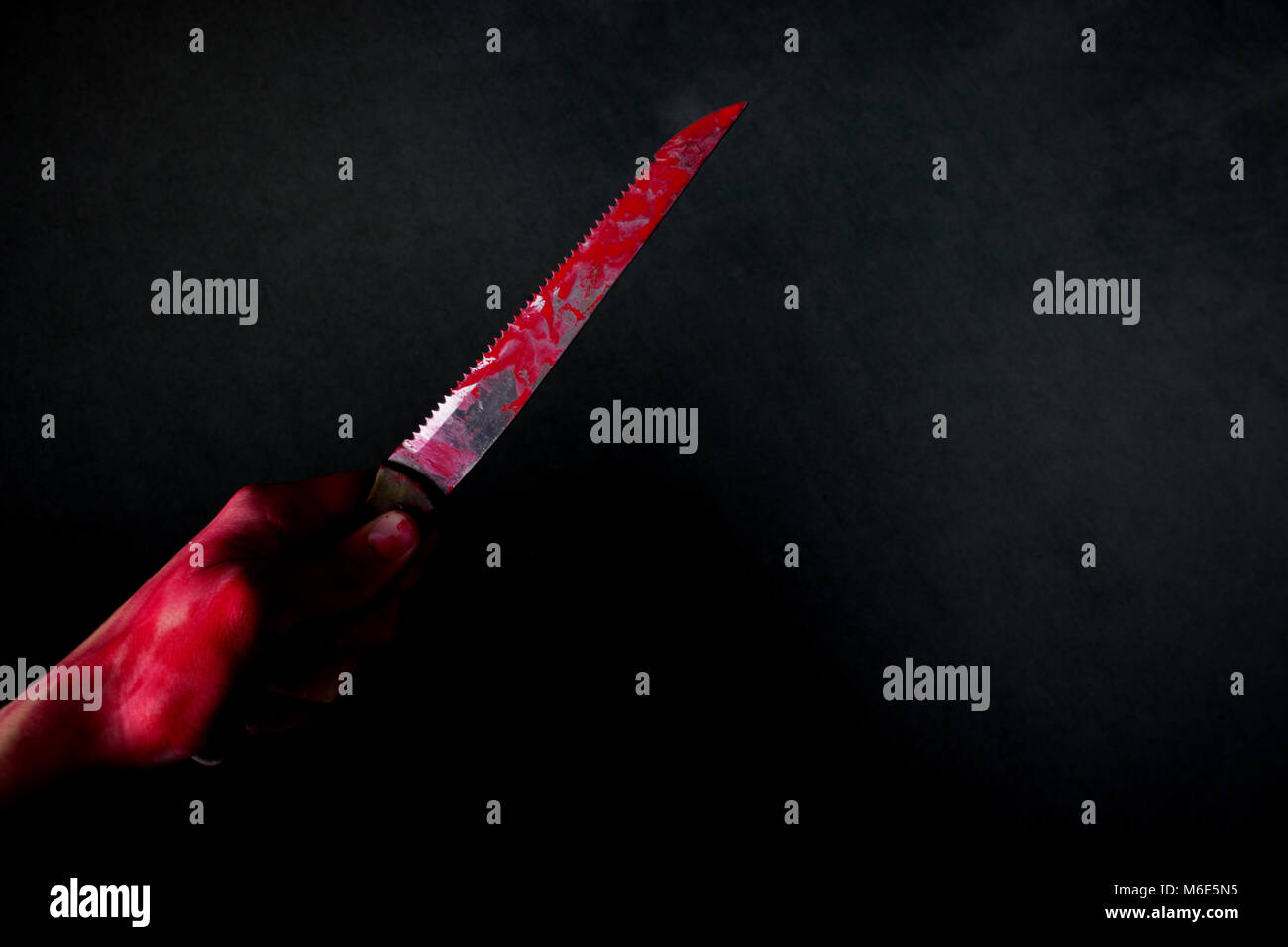 Bloody stabbing. Hand with knife. knife, horror, blood Stock Photo - Alamy