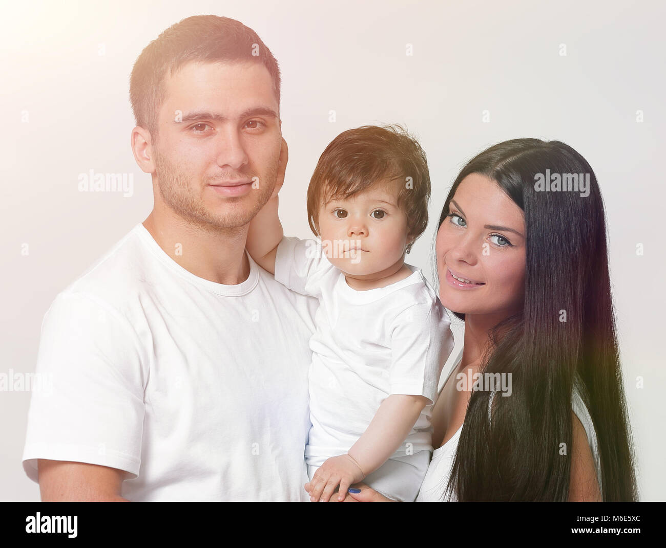 Happy family with newborn baby on a white background Stock Photo - Alamy