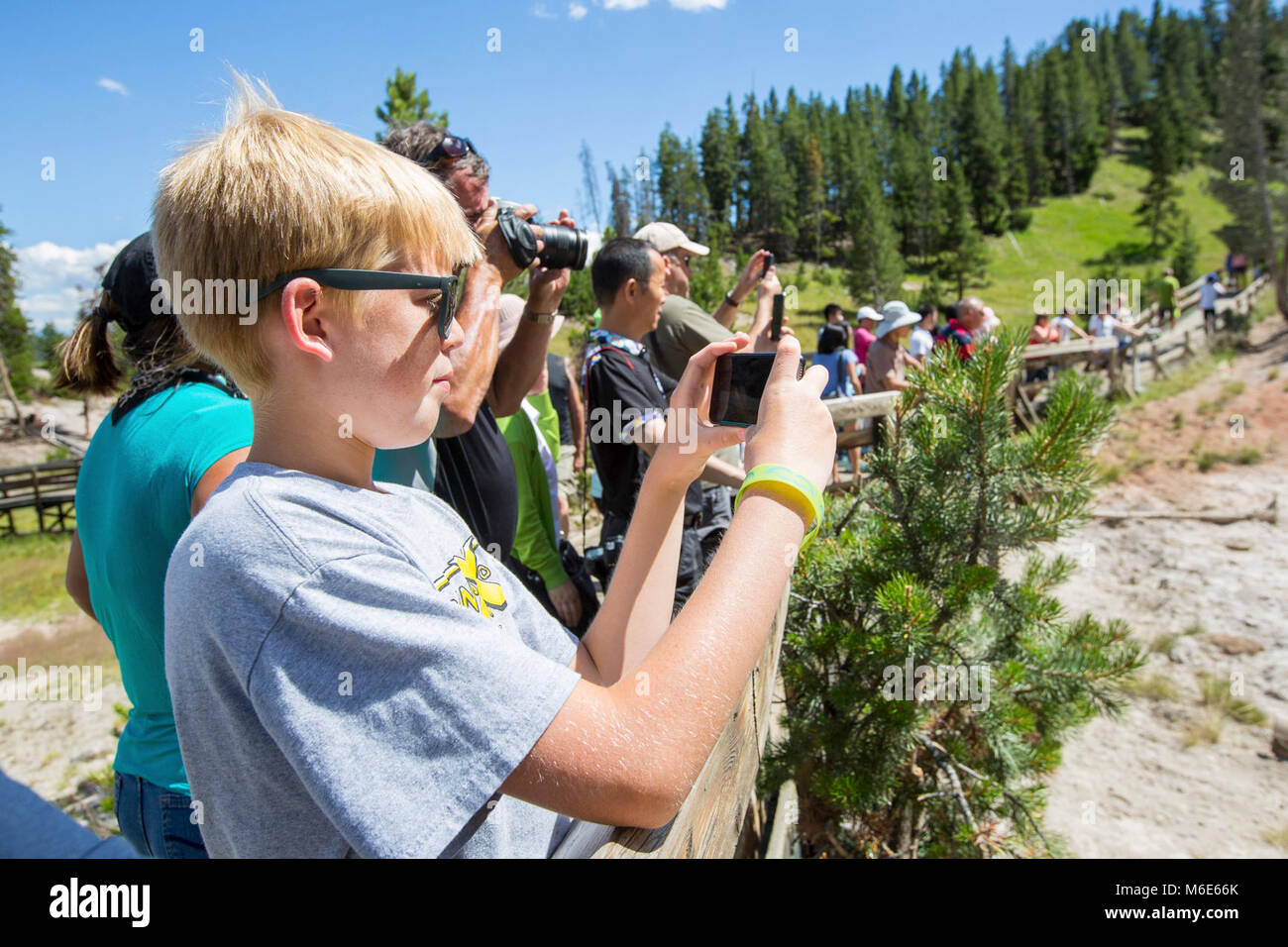 Filming with the crowd at Mud Volcano Stock Photo - Alamy