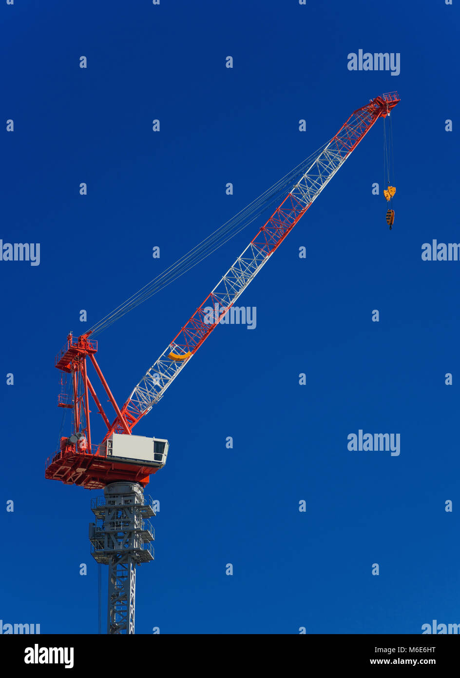 Construction fixed crane with cabin at work Stock Photo - Alamy