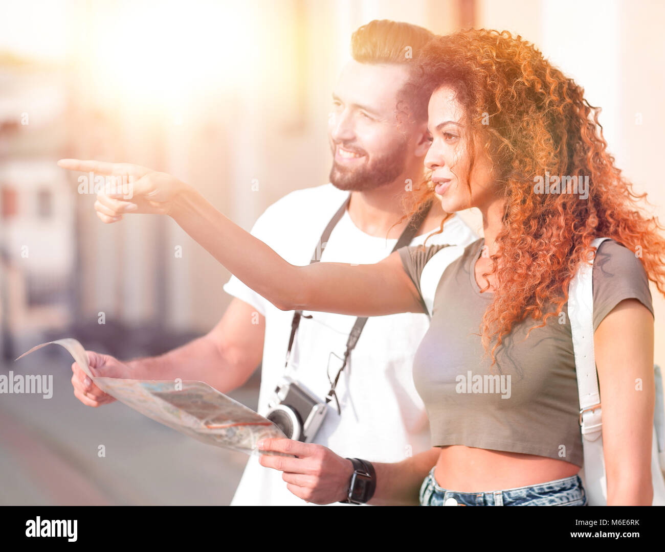 A pair of happy young tourists sightseeing in summer Stock Photo - Alamy