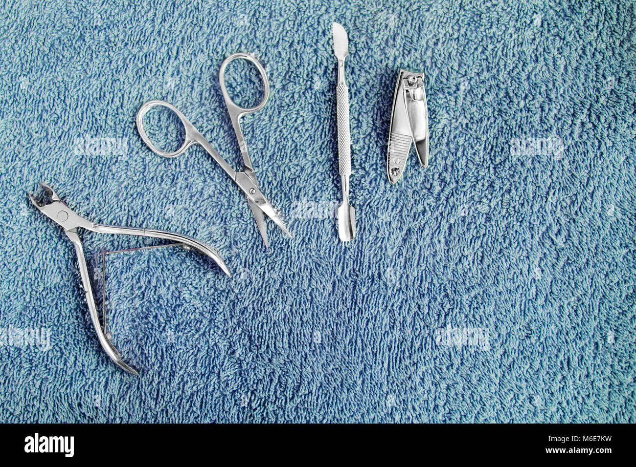 Set of manicure instruments on towel. Nail care, top view Stock Photo ...