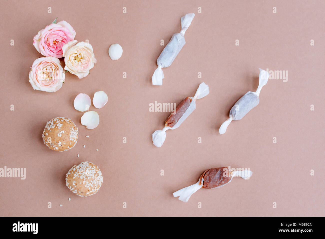 Handmade sweets with flowers on pink background. Top view, flat lay ...