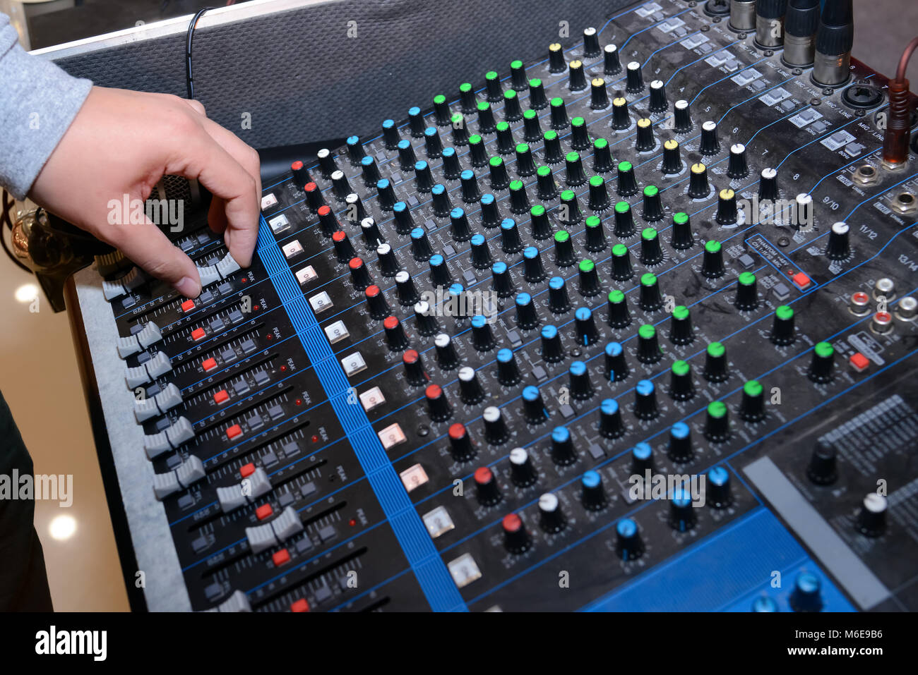 hand operating sound mixer console Stock Photo - Alamy