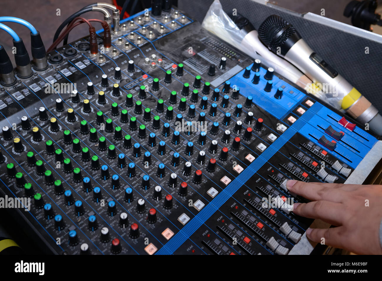 hand operating sound mixer console Stock Photo - Alamy