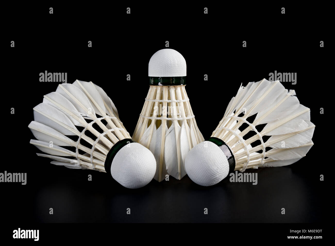 three brand new shuttlecocks on a black background Stock Photo - Alamy