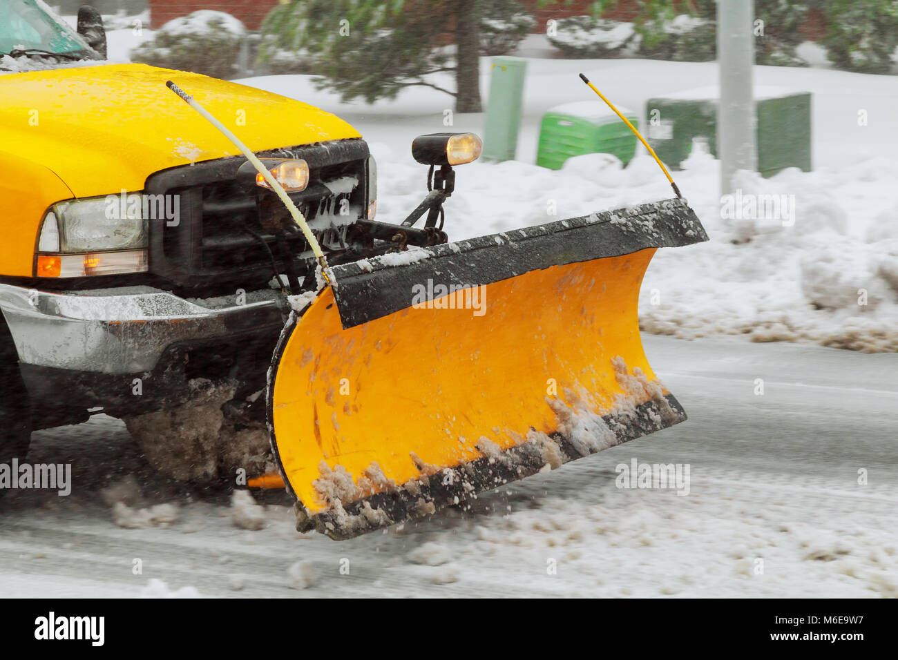 Snow plow cleaning snow from city road snow blizzard clearing roads ...