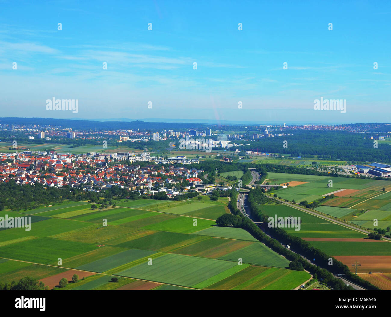 Aerial view of a town in Stuttgart area with german Autobahn A8 leading ...