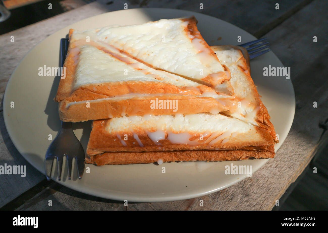 toast with thick milk topping Stock Photo - Alamy