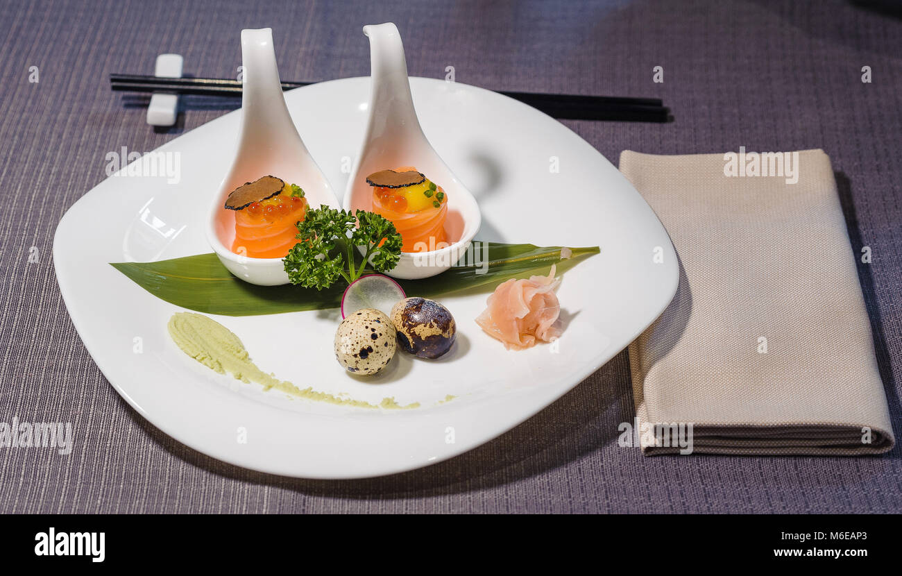 raw quail eggs with truffle and horseradish, served with wasabi and ...