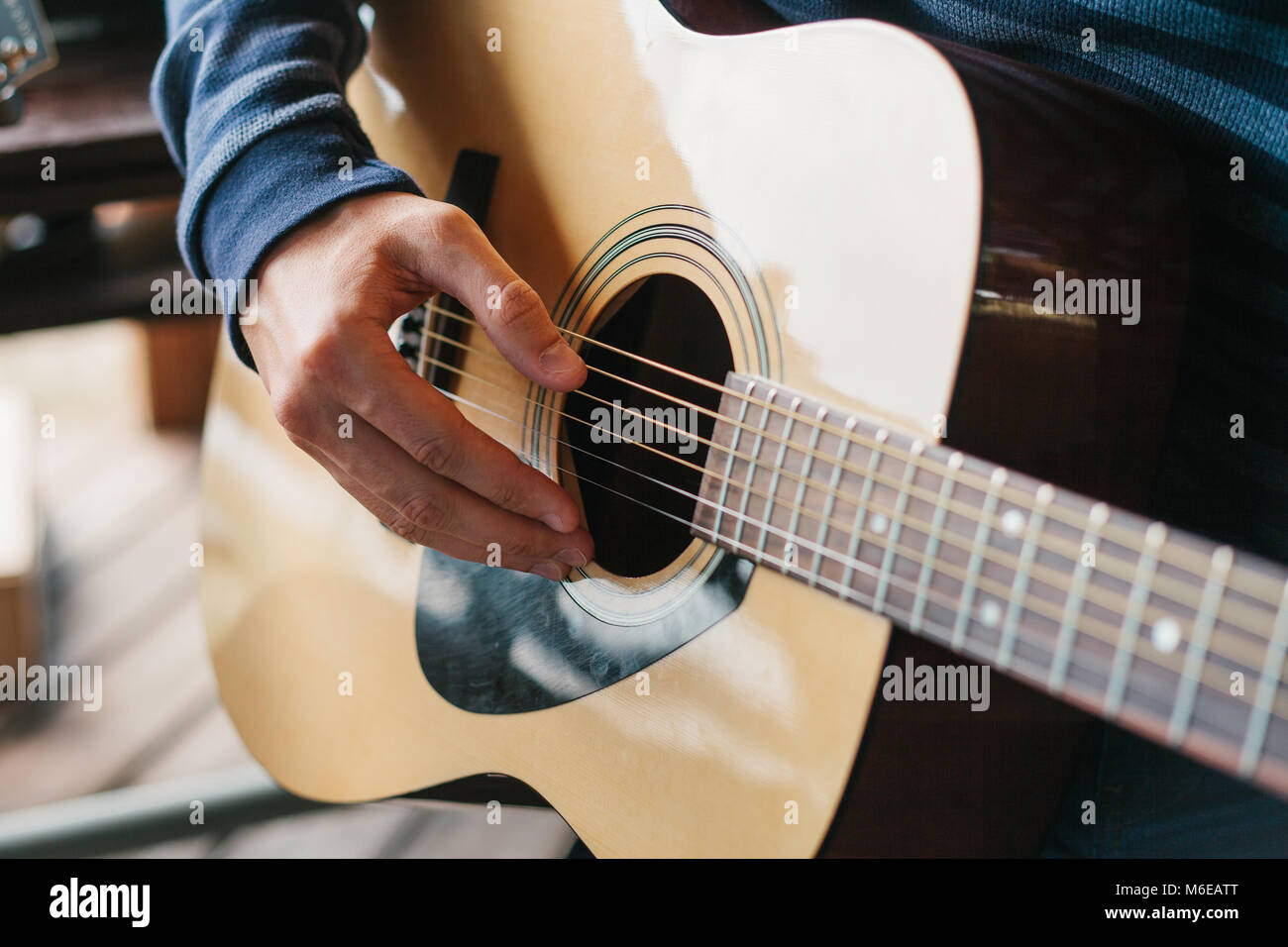 Learning to play the guitar. Music education Stock Photo - Alamy