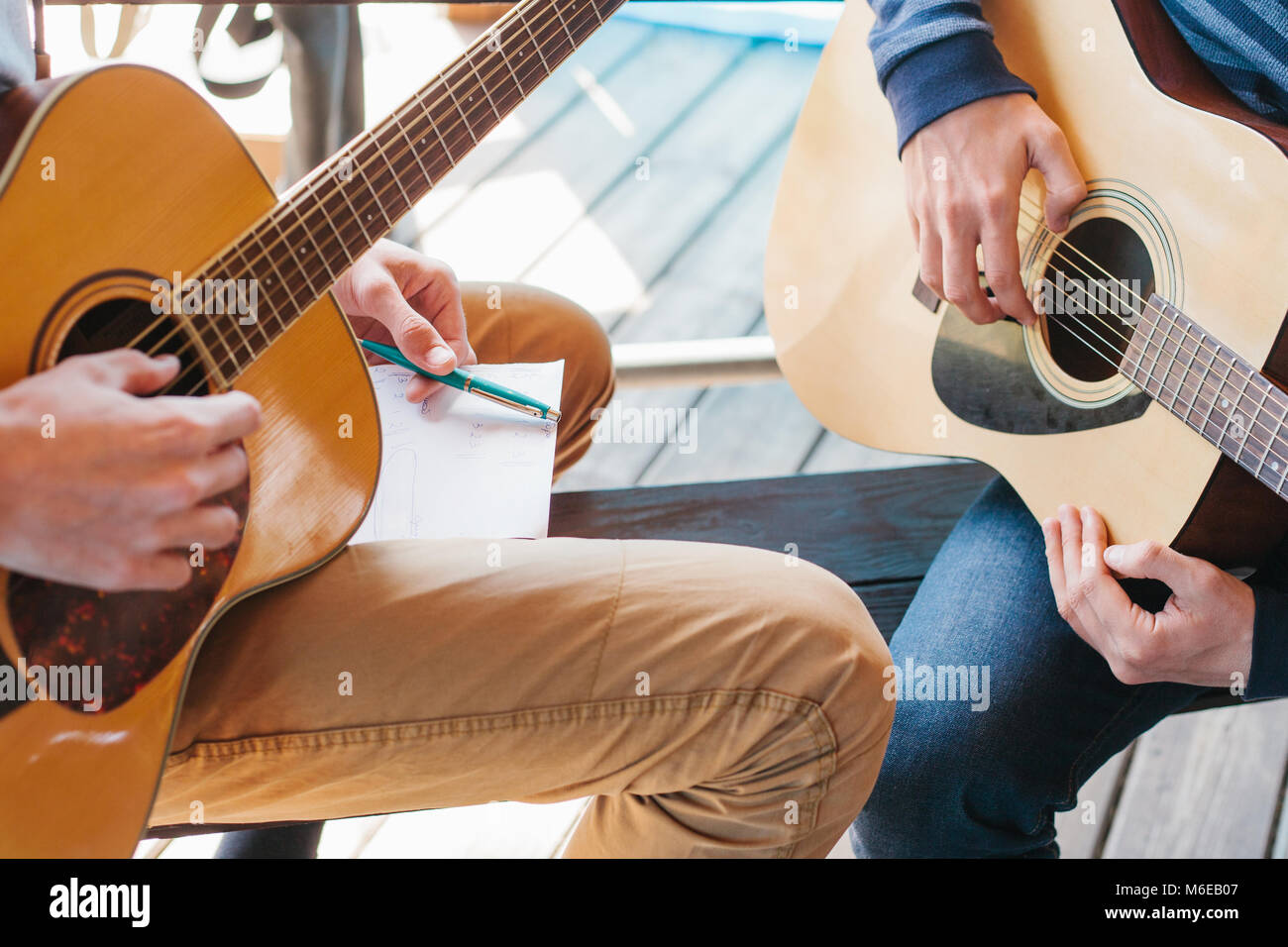 Learning to play the guitar. Music education Stock Photo - Alamy