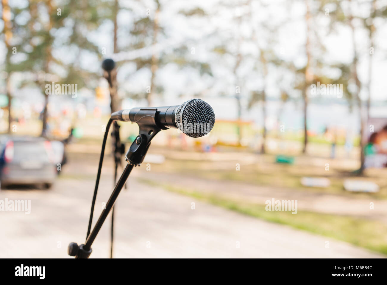A microphone on stage. The concept of a concert in the open air Stock ...