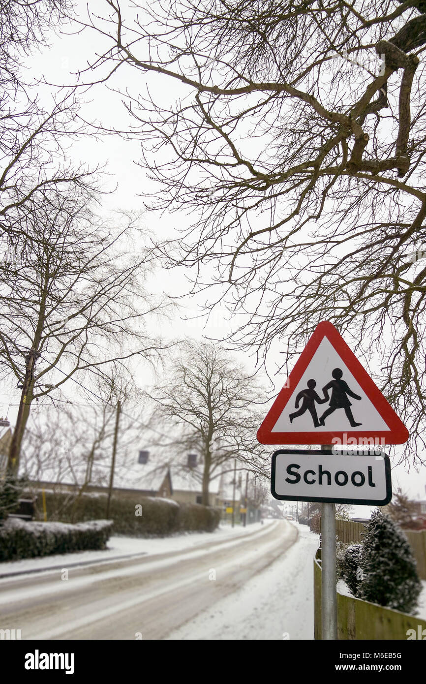 School closure: Village cut off by snow. Snow background. School sign ...