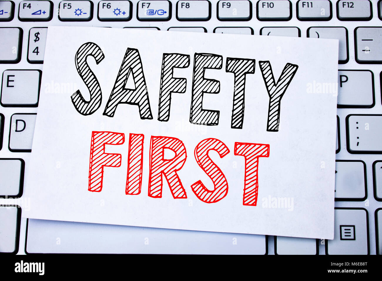 Handwritten text caption showing Safety First. Business concept writing ...