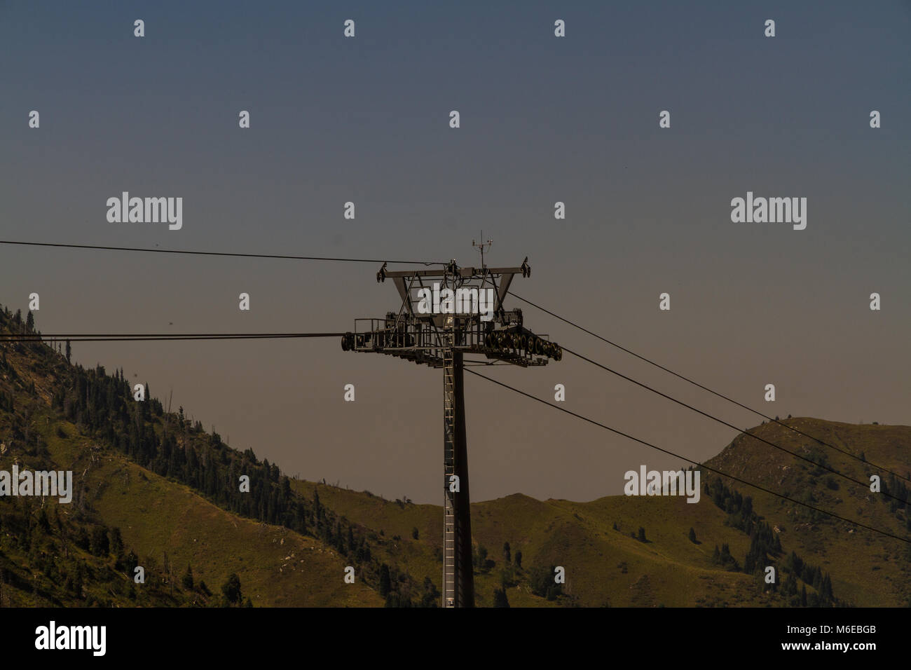 Pylon and pod of cable car with mountains in Summer. Shymbulak Ski ...