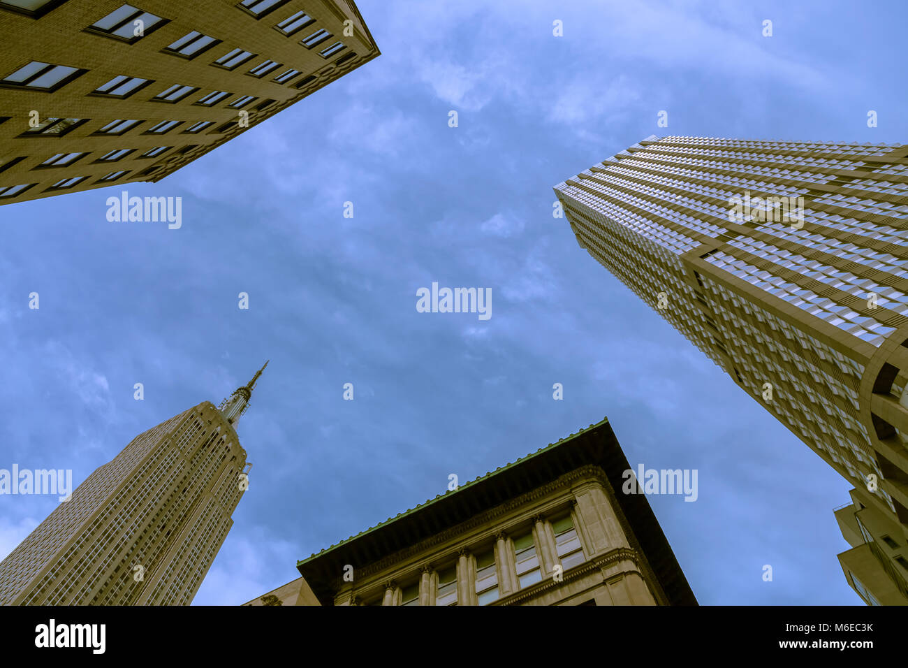 The iconic Empire State Building and other high rises, view at the low ...