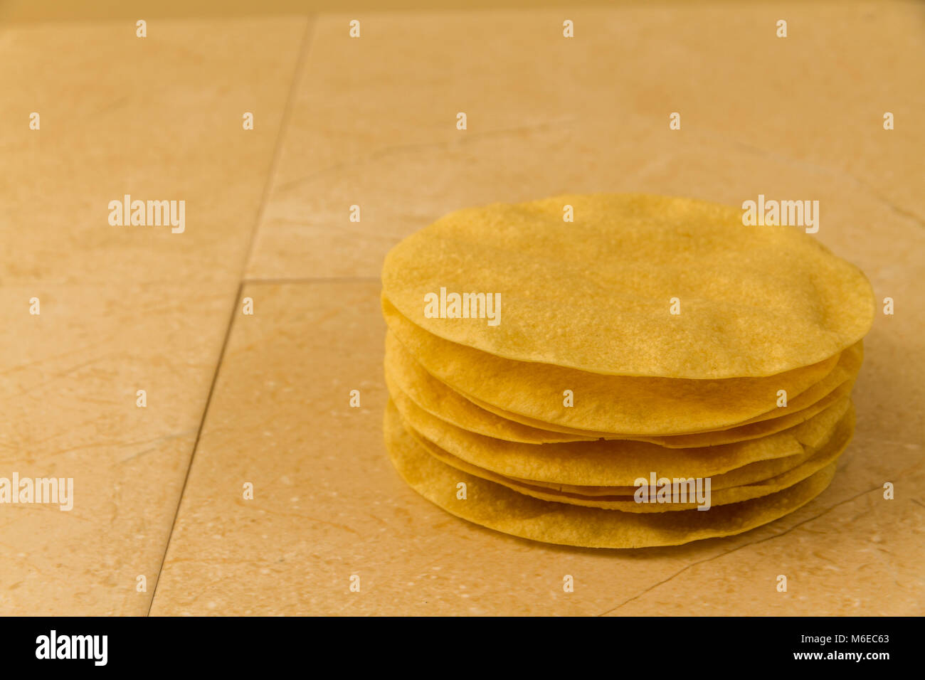 Indian poppadums stacked with copy space on left Stock Photo - Alamy