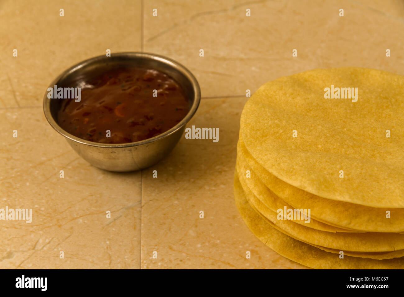 Indian poppadums stacked with bowl of mango chutney Stock Photo - Alamy