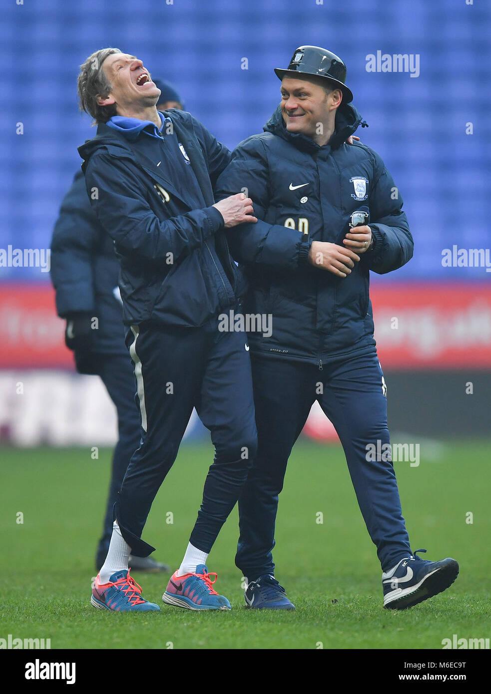Preston North End manager Alex Neil (right) shares a joke with kit man ...