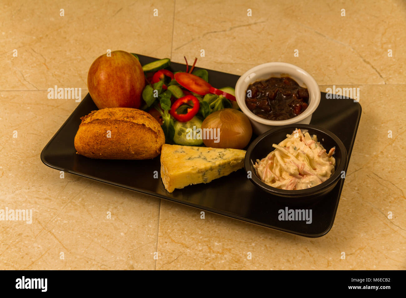 Ploughman’s lunch with stilton cheese, pickle, pickled onion, salad ...