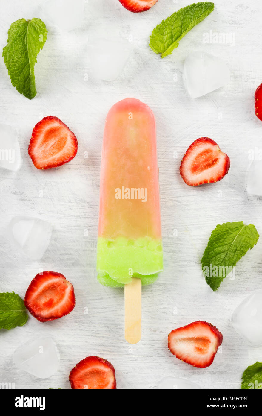 Multi-colored popsicles on a white background. Top view. Food ...
