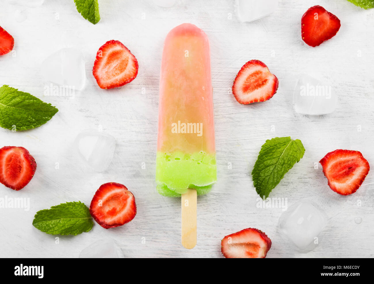Multi-colored popsicles on a white background. Top view. Food ...