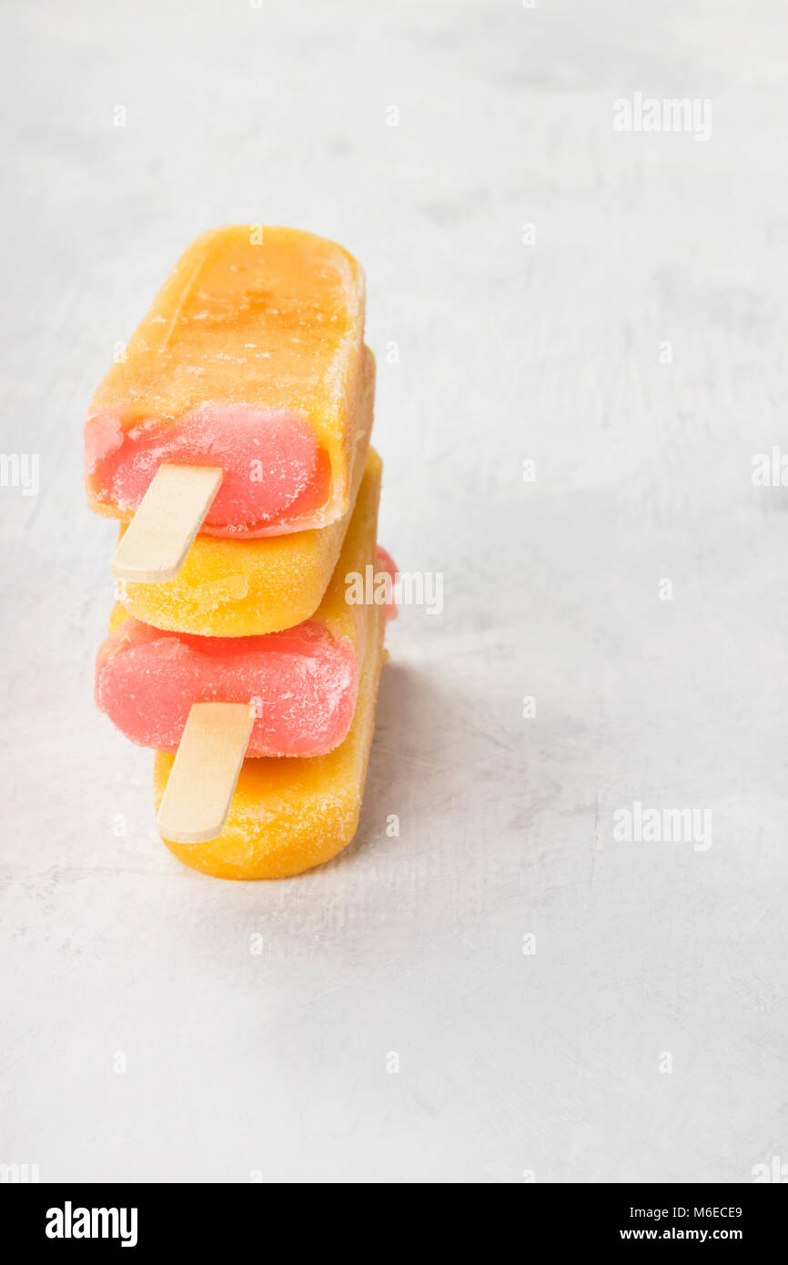Multi-colored popsicles on a white background. Copy space. Food ...