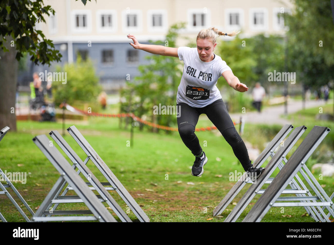Jumping an obstacle at Action run 2017 obstacle race run in the city of ...