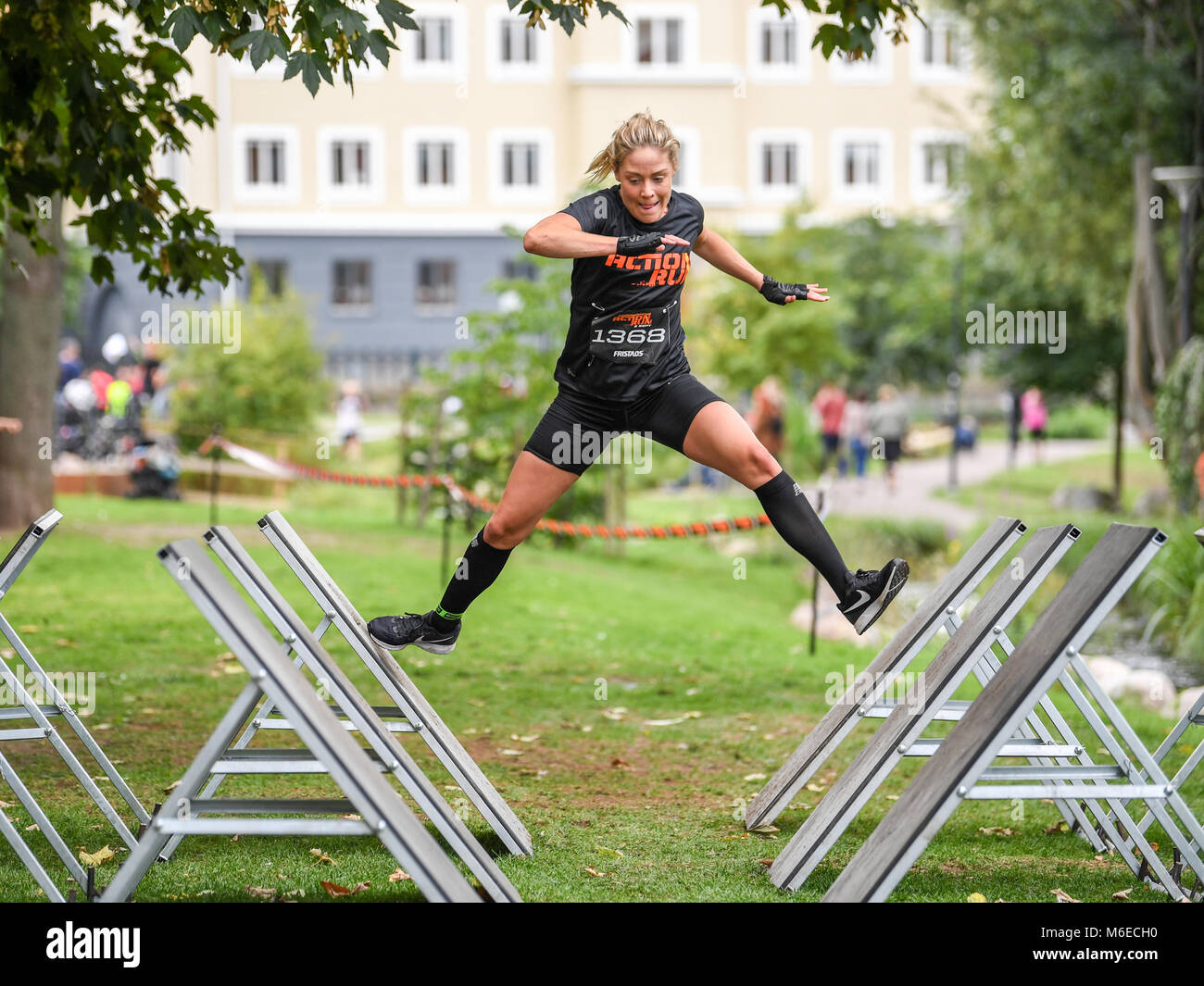 Jumping an obstacle at Action run 2017 obstacle race run in the city of ...