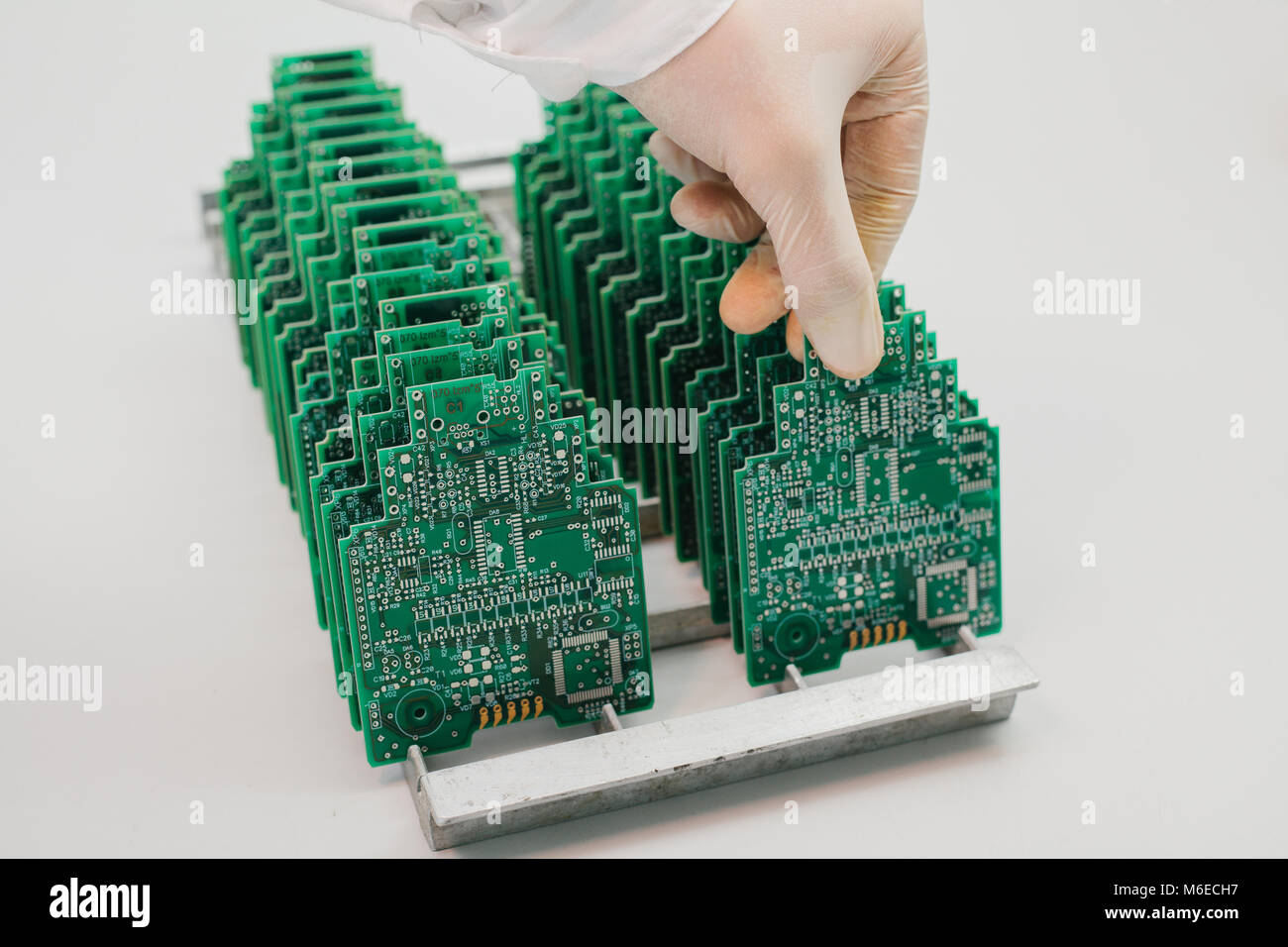 The technician takes a computer board with chips. Spare parts and ...