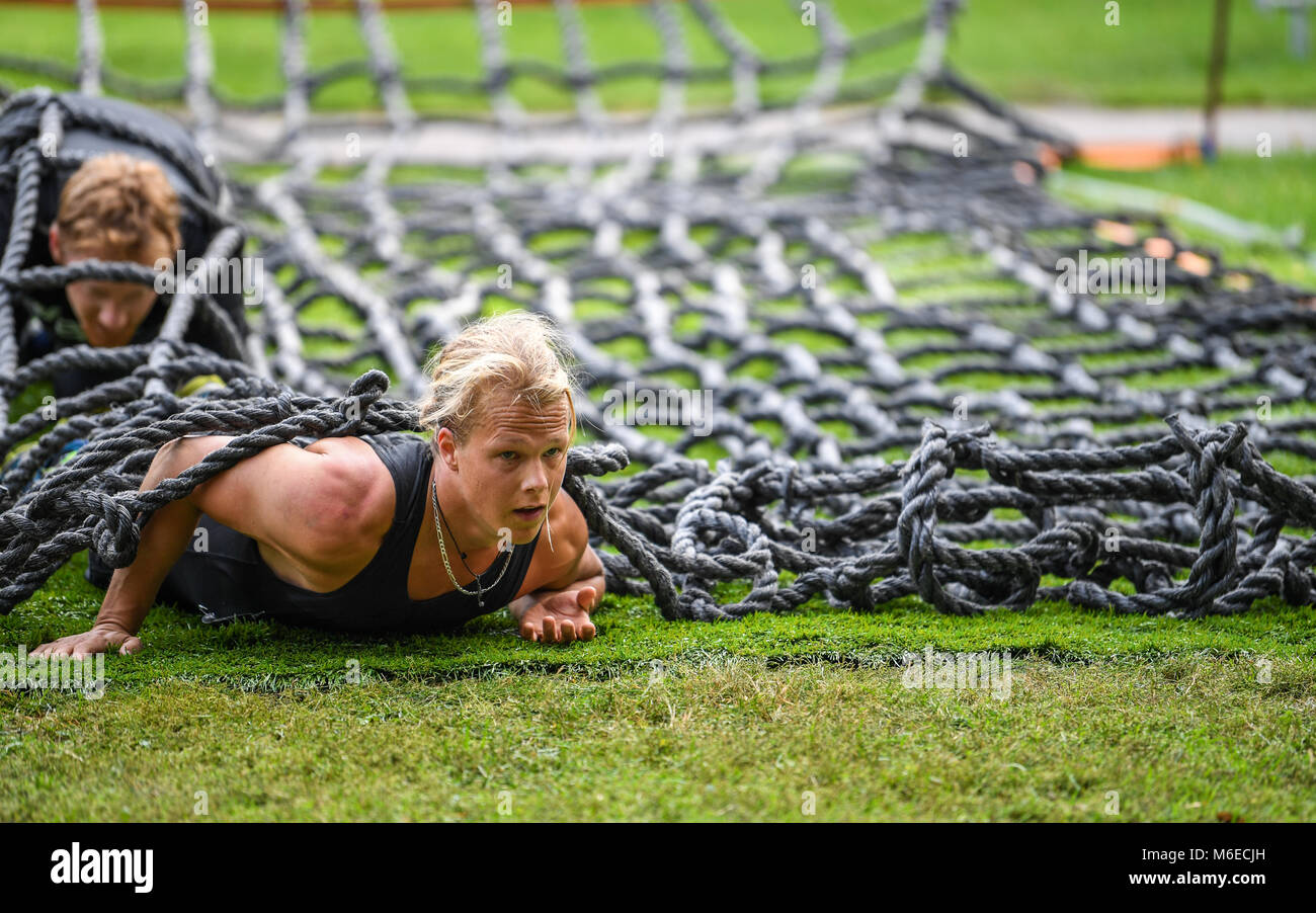 Crawling obstacles at Action run 2017 obstacle race run in the city of ...