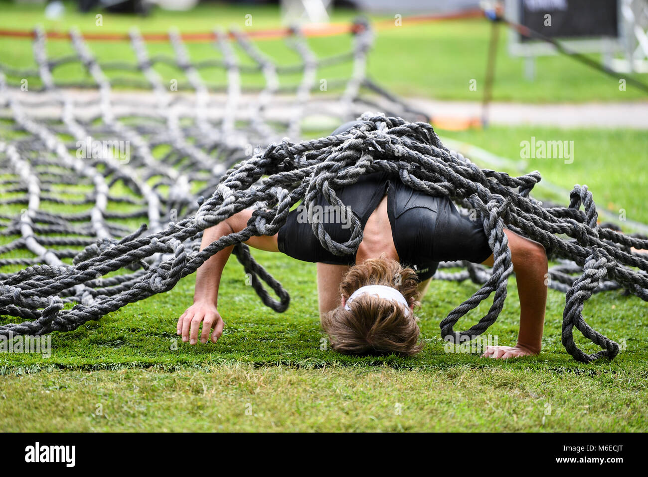 Crawling obstacles at Action run 2017 obstacle race run in the city of ...