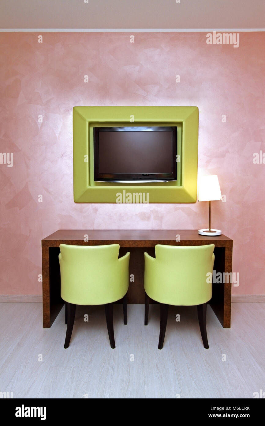 Modern interior with large tv screen on wall Stock Photo - Alamy