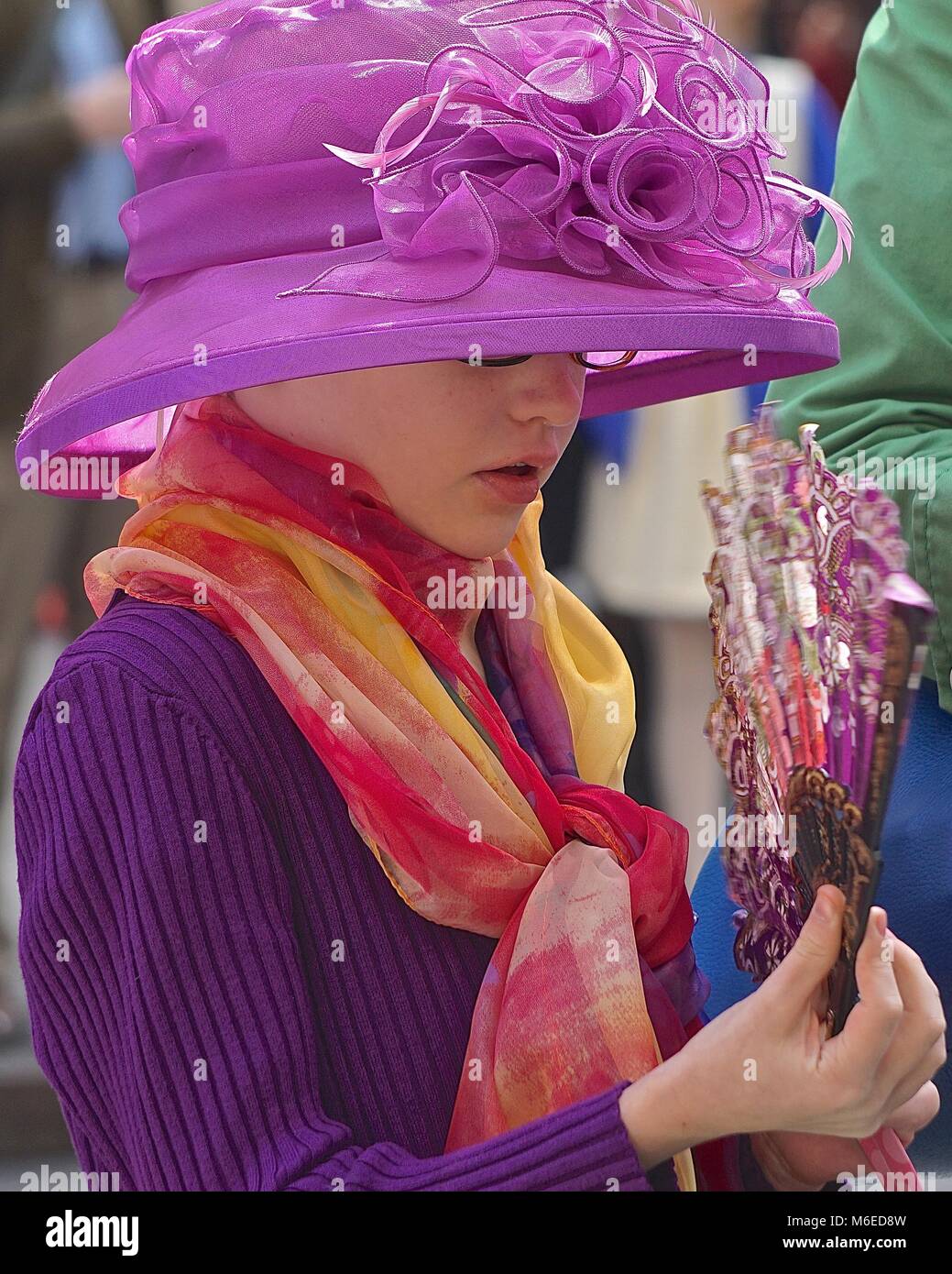 New York, New York, USA: A little girl in a purple flowered bonnet and ...