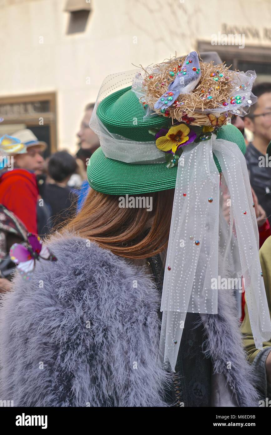 New York, New York, USA: Woman wearing a green bonnet with a bird’s ...