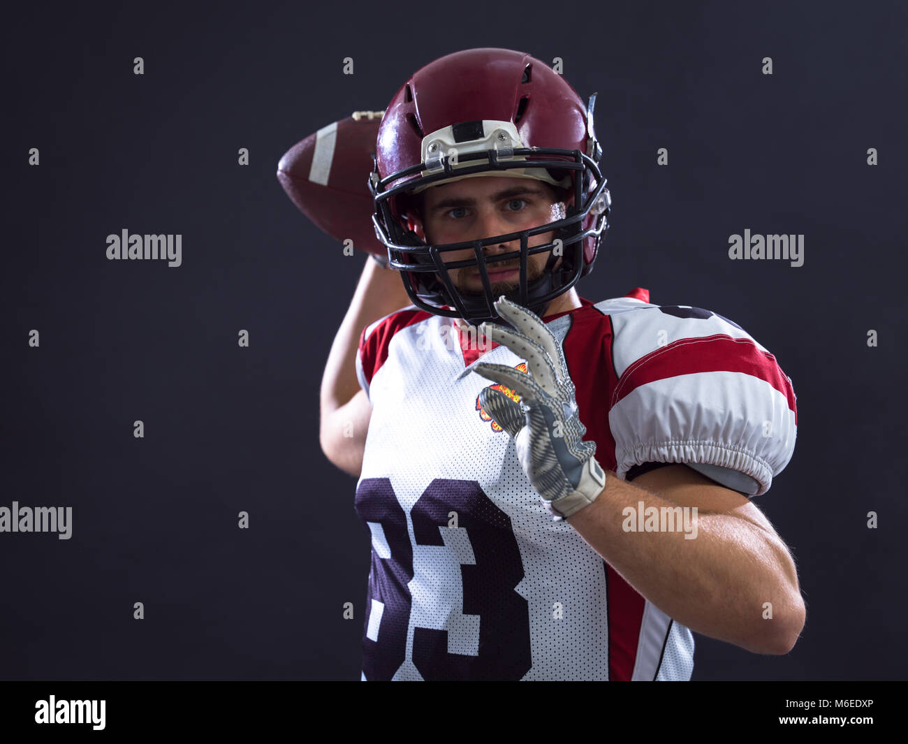 one quarterback american football player throwing ball isolated on gray ...