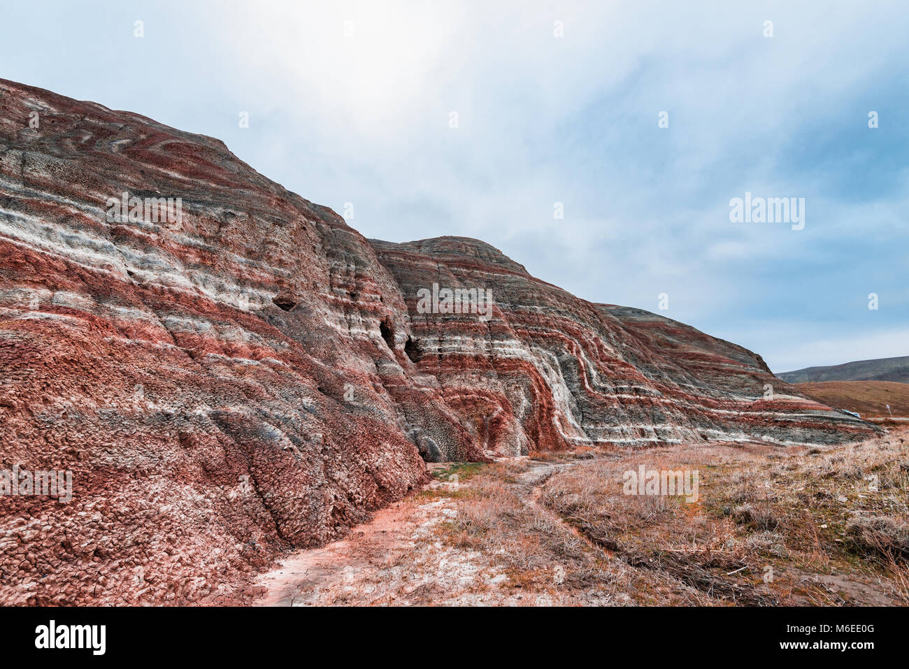Amazing striped red mountains Stock Photo - Alamy
